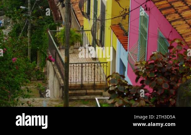 Tilting shot of a middle class neighborhood and a favela in Rio de ...