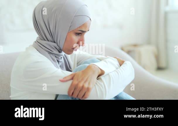 Sad depressed Muslim woman in hijab feels unhappy by psychological ...