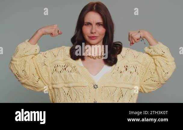 I am strong and independent. Proud success woman showing biceps and ...