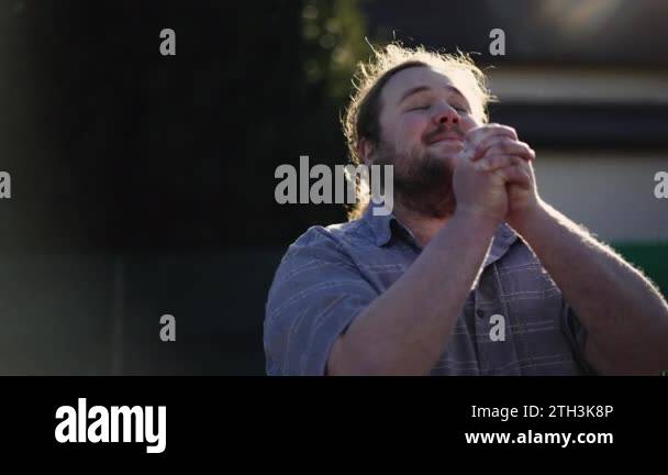 Spiritual young man praying to GOD outdoors in sunlight. A male ...