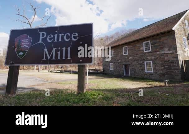 The National Park Service Peirce Mill sign and the historic mill ...