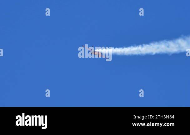 Thiene Italy OCTOBER, 17, 2021 Orange aerobatic plane in inverted ...