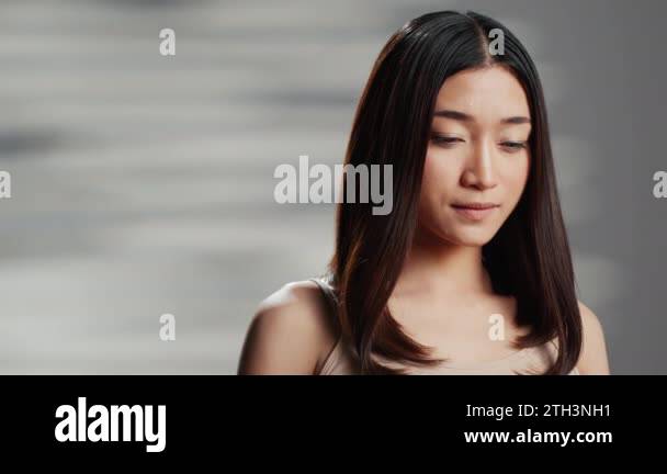 Female model embracing imperfections for self love ad, asian girl ...