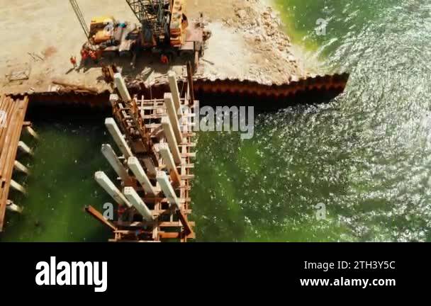 Pile driving is installing concrete pile. Heavy construction equipment ...