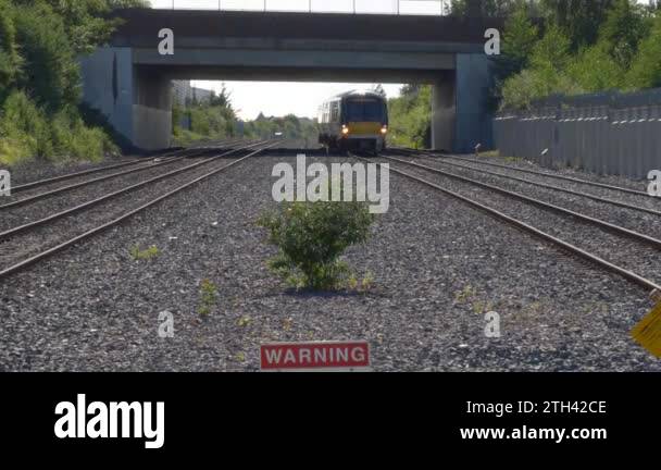 Dublin, Ireland - Train Approaching The Station With Warning Sign Do ...
