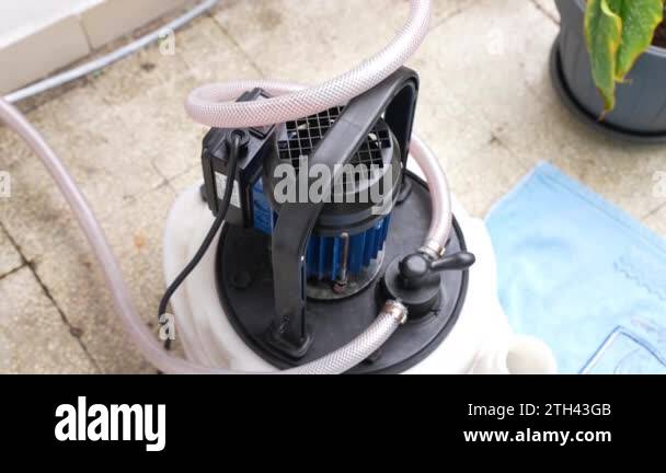 Professional plumber man cleaning home boiler and water pipes with hot ...