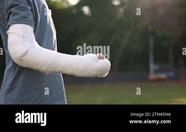 cropped shot of broken hand of child boy who greets another boy with a ...