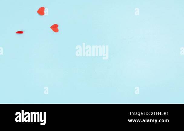 4k Red paper hearts fly like butterflies to woman's hand. Fly into an ...