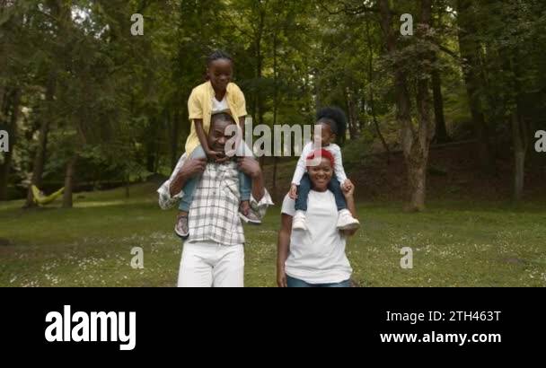 Parents carrying kids on shoulders Stock Videos & Footage - HD and 4K ...