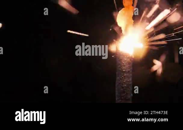 Sparkler on the black background in slow motion, macro shot. Lightening ...