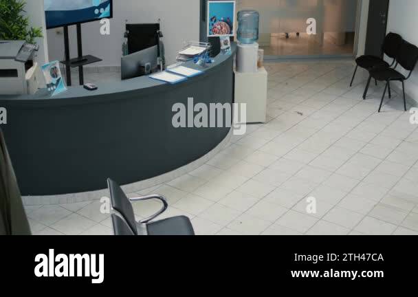 Empty hospital reception desk with lobby and waiting area, medical ...