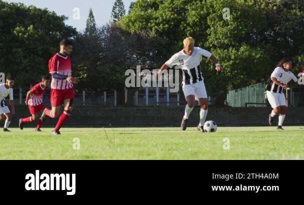 Video of diverse group of male football player on field, playing ...