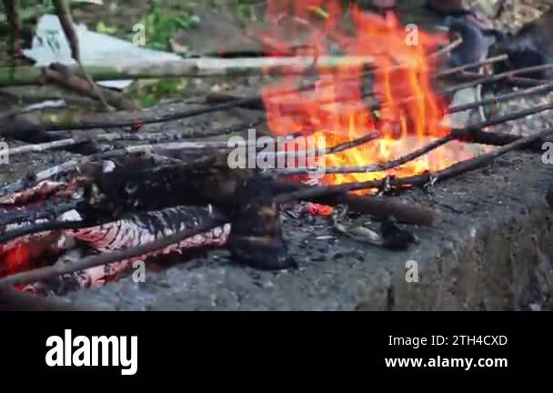 Legs of goat burned with fire from firewood. Eid al-Adha celebration in ...