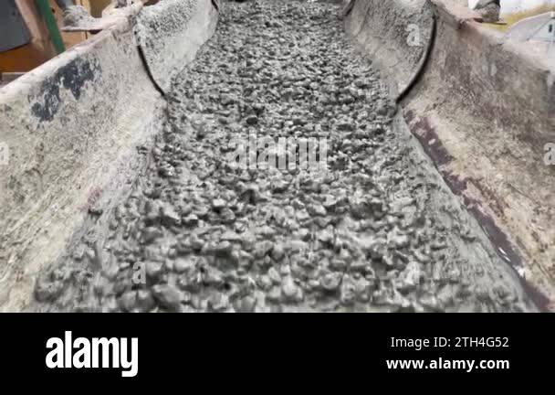 Pouring concrete mix on concreting formwork. Forming, an essential part ...