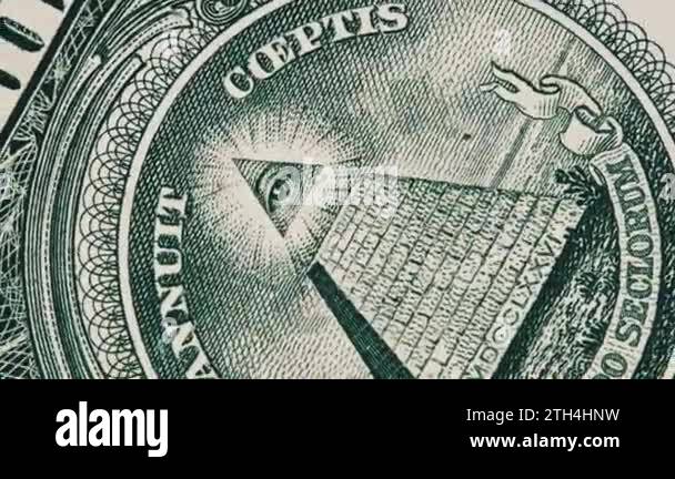 The all-seeing eye sign rotates on a one dollar bill close-up. Mason ...