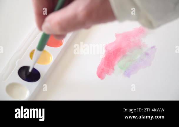 Painter using multi color palette to create a paining Stock Video ...
