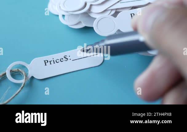 100 dollar price tag on a shirt Stock Video Footage - Alamy