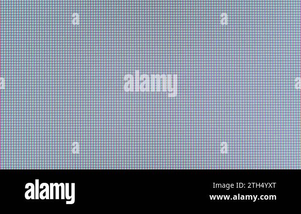 Macro view of a television LED screen with RGB sub-pixels. Colored ...