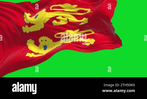 The flag of Normandy region waving in the wind isolated on a green ...