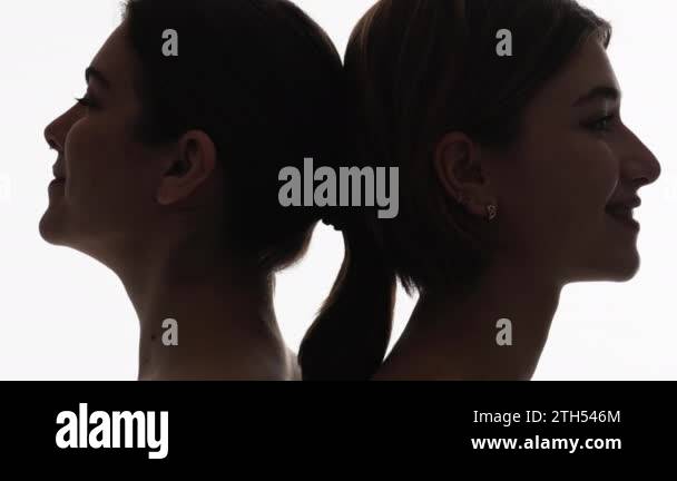 Close relationship. Happy women. Silhouette portrait. Smiling profile ...
