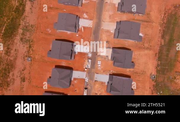 The unfinished subdivision construction site of an incomplete ...