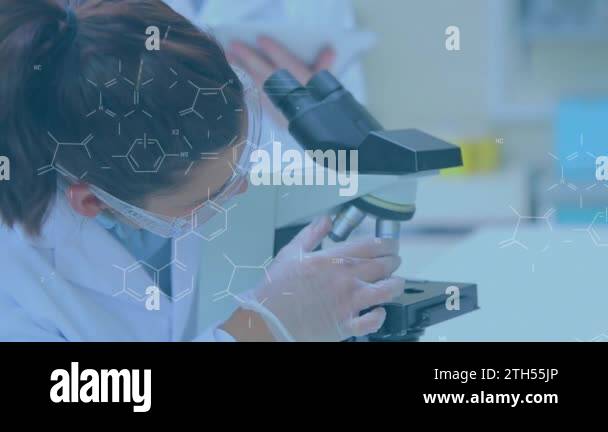 Animation of chemical formulas over biracial female lab worker using microscope. Animation of ...