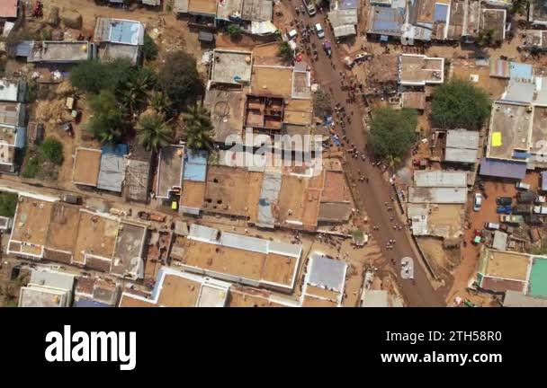 An aerial top view of an Indian village with old buildings and roads ...