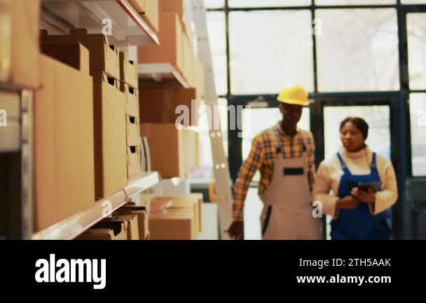 Team of workers planning products shipment in depot, woman answering ...