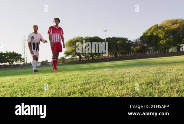 Video of diverse group of male football player on field, playing ...