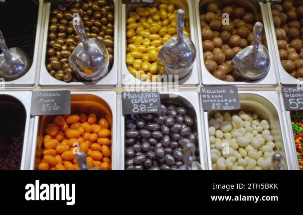 supermarket showcase with nuts and sweets, russian inscriptions with ...