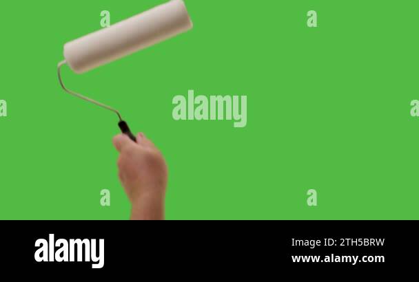 Male Using Paint Roller Two Strokes Across Green Screen Stock Video ...