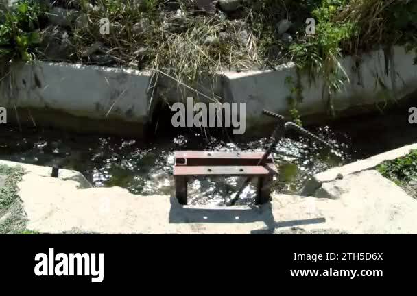 A muddy river with brown water. Slow current. A muddy river during a ...