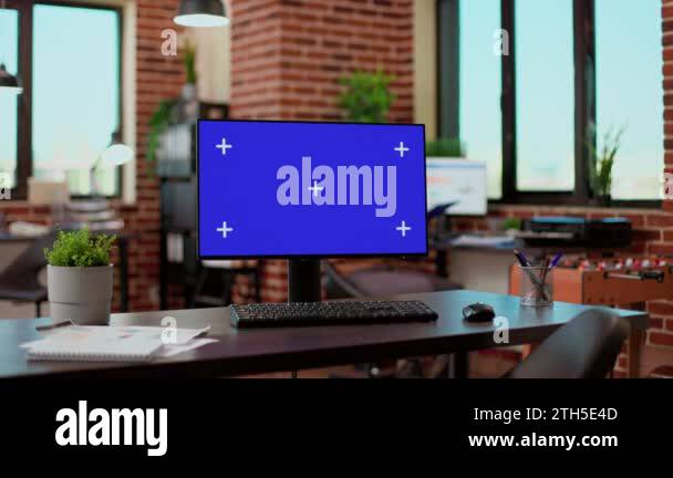 Empty Office Desk With Greenscreen Display On Computer Desktop