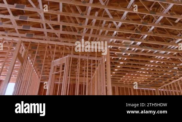 New wooden building with wood beams and roof trusses under construction ...