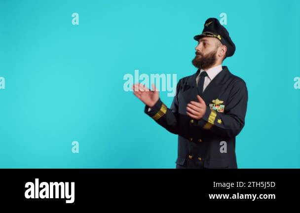 Male aviator applauding and cheering on camera, saying congratulations ...