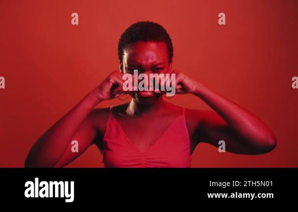 Whining grimace. Capricious mood. Hurt feeling. Red neon color light ...