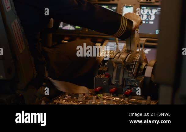Aviation crew flying airplane with engine lever to throttle, using ...