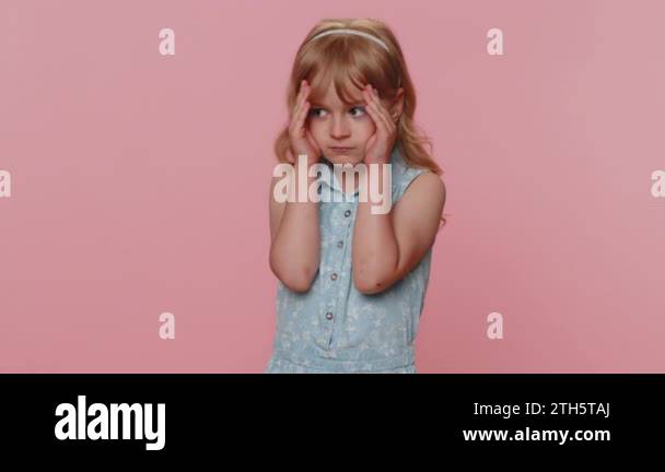 Nosy curious young preteen child girl kid closing eyes with hand and ...