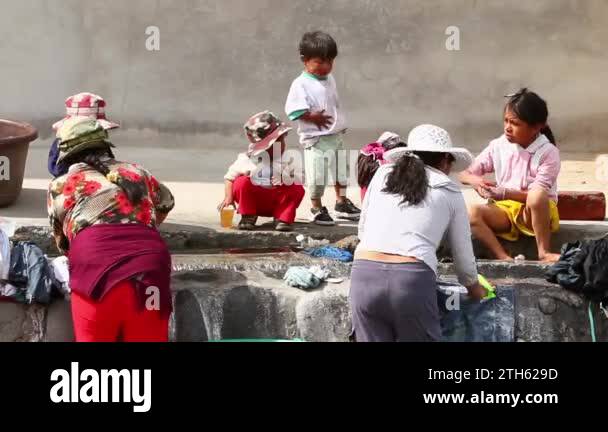 Poor People Doing Street Laundry Stock Video Footage - Alamy