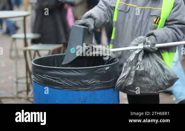 People throwing litter in waste bin, environmental pollution, global ...