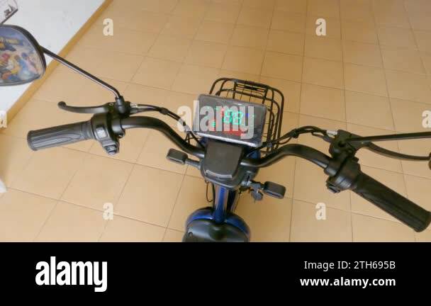 Moment of turning on the ignition e-bike. Turn the key and turning ...