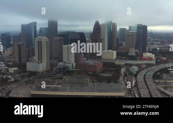 This video is about an aerial of downtown Houston on a rainy and cloudy ...