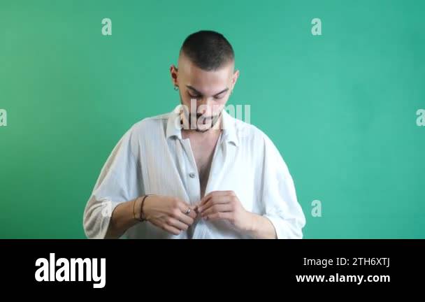 Man undressing from the heat, male model sweating in extreme heat, male ...