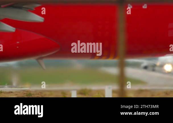 Airplane landing gear view, taxiing, close-up. Aircraft jet engine and ...