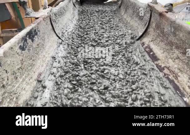 Pouring concrete mix on concreting form work. Forming, an essential ...