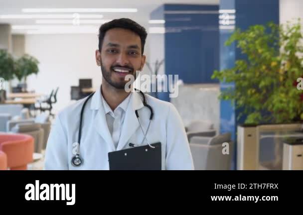 Determined Indian or Pakistani Handsome Doctor Wearing White Coat with ...