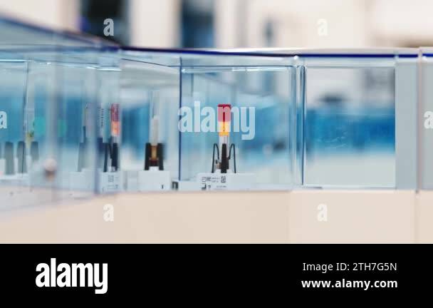 Blood samples, empty test tubes and test tubes holders moving around on ...