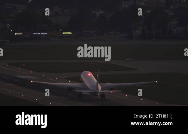 Looking at ascending airplane from the ground. Rear view of flying ...