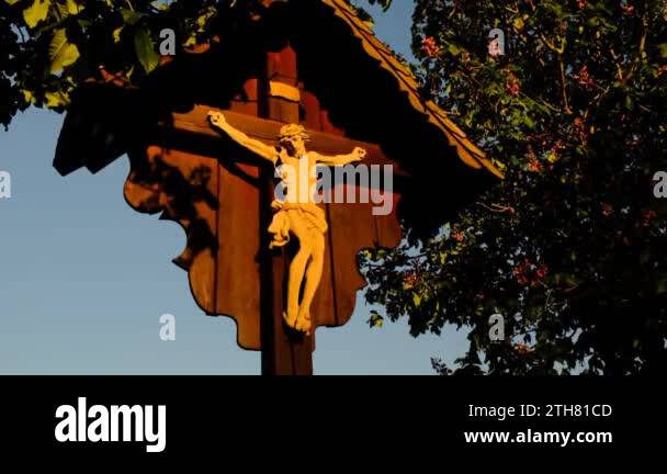 Jesus Christ on the cross in blooming chestnut trees.Christian and ...