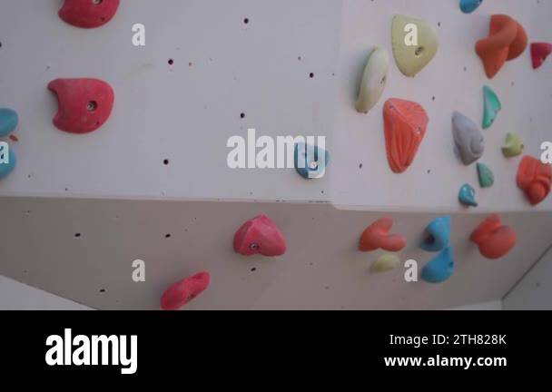 Climbing artificial rock climbing wall to practice mountain bouldering ...